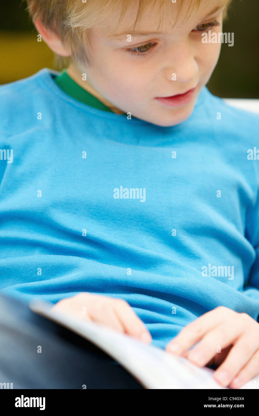 Boy Reading Book Stock Photo - Alamy