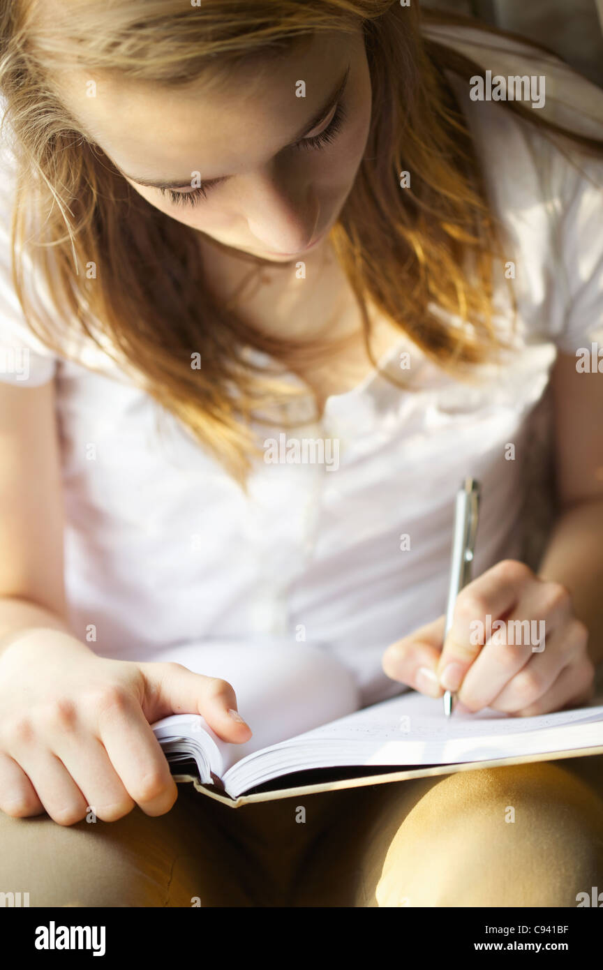 Teenage Girl Writing Stock Photo - Alamy