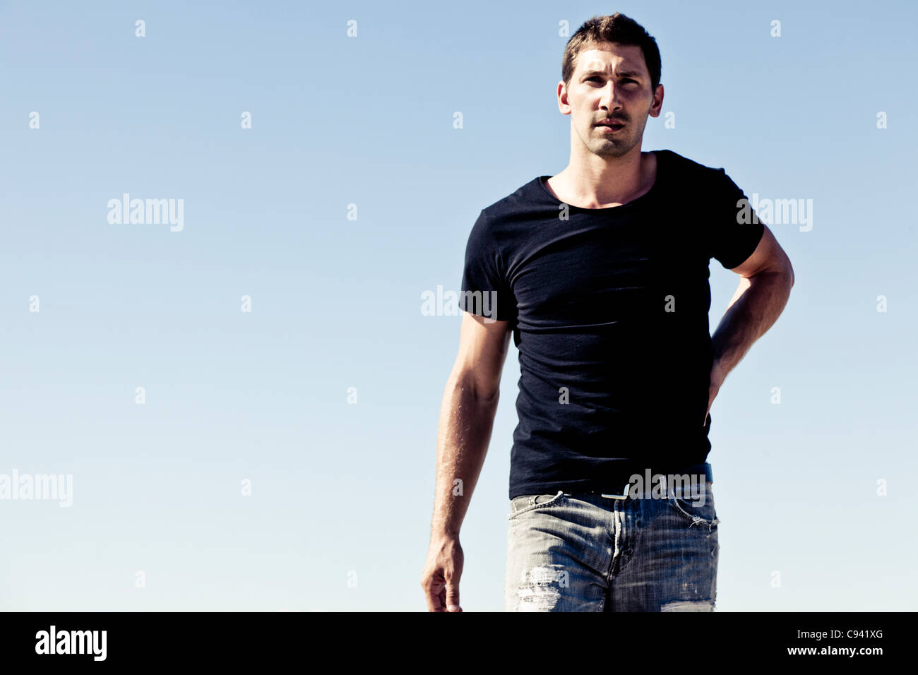 Man Standing With One Hand On Hip High Resolution Stock Photography and ...