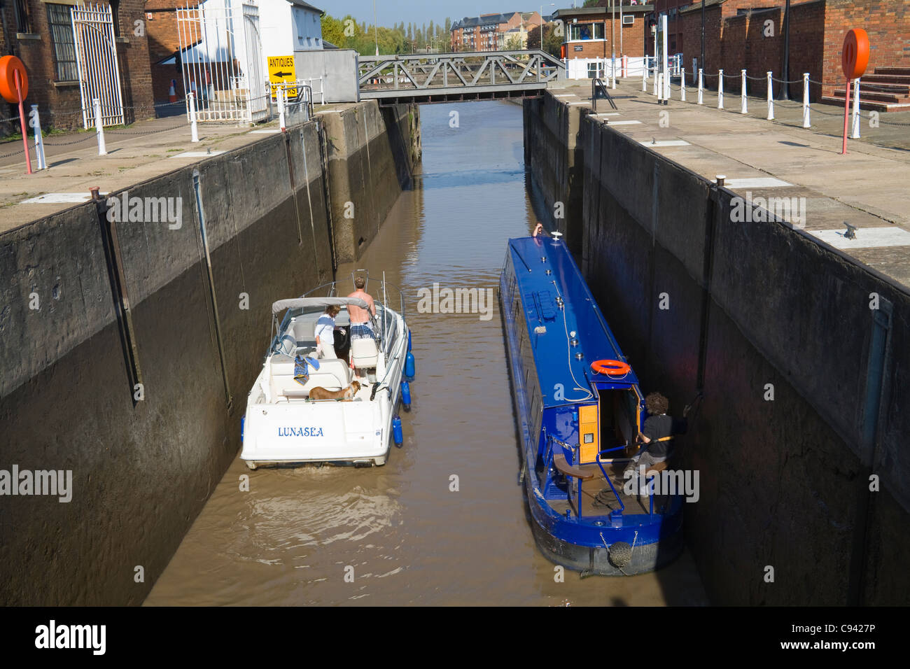 Gloucester Docks Speed boat and narrowboat waiting for lock to empty to ...