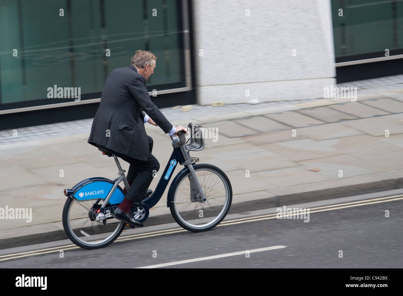 boris bike pinstriped city gent riding boris bike barclays rental cycle ...