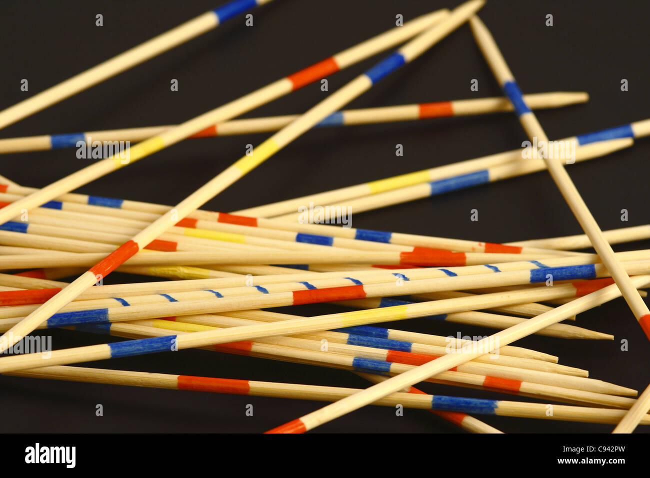 small sticks on the black background Stock Photo - Alamy