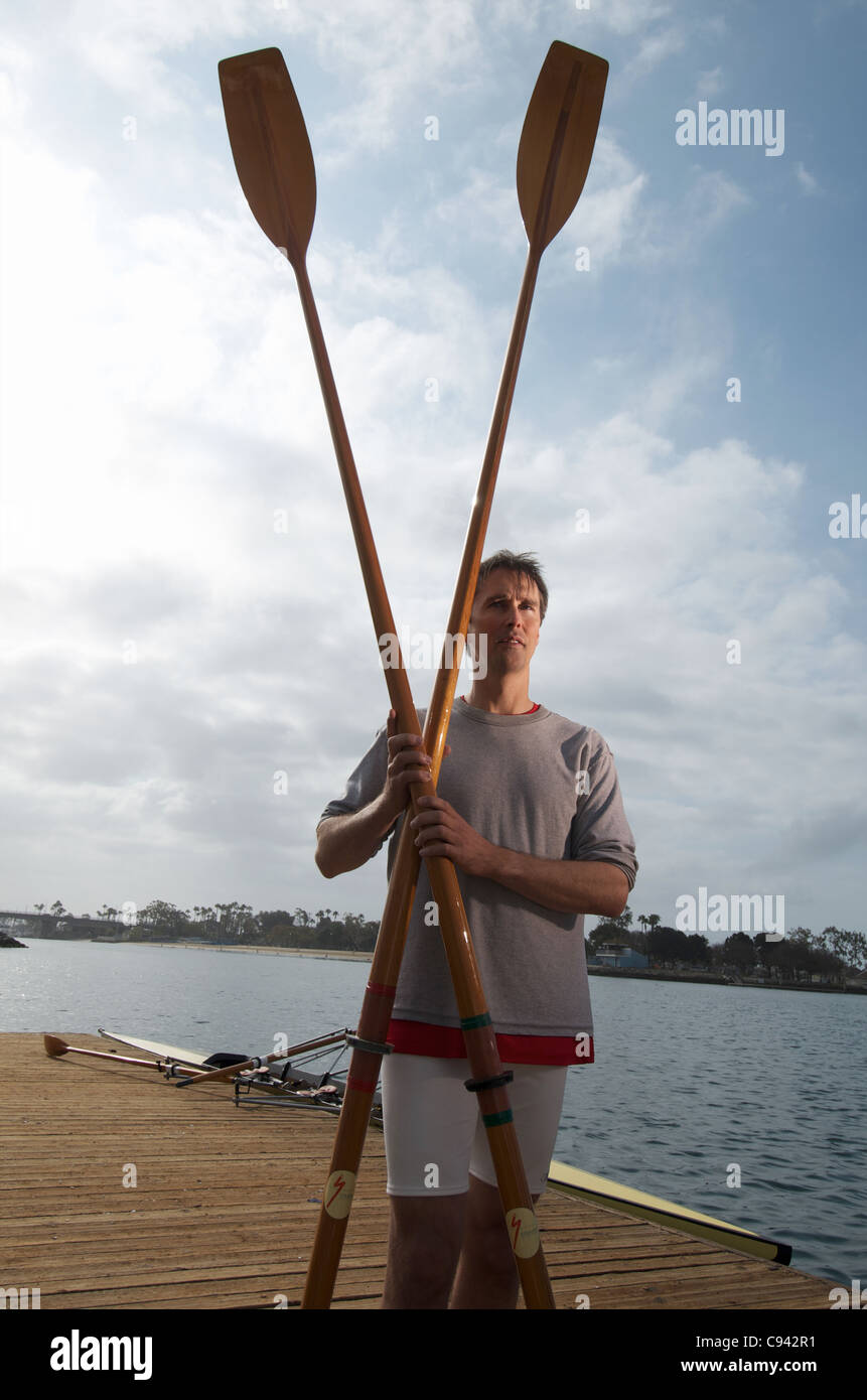 A portrait of a rower, oars and his double scull rowboat Stock Photo ...