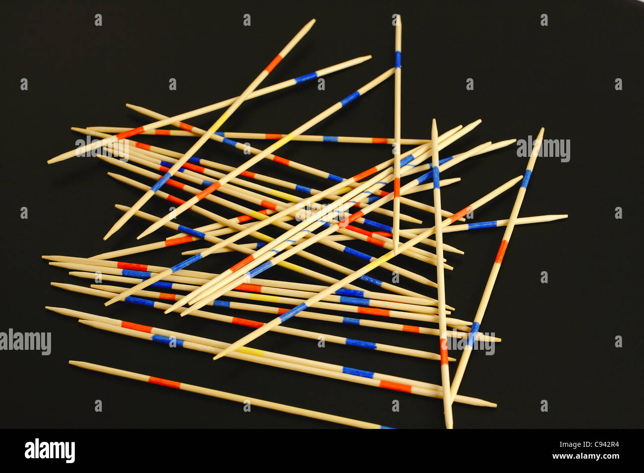 small sticks on the black background Stock Photo - Alamy