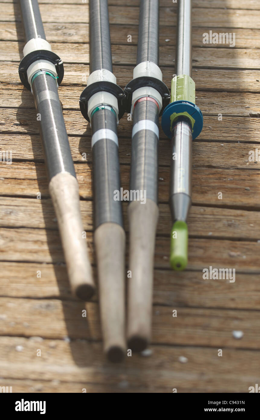 Detail of boat oars on a dock at a lake Stock Photo - Alamy