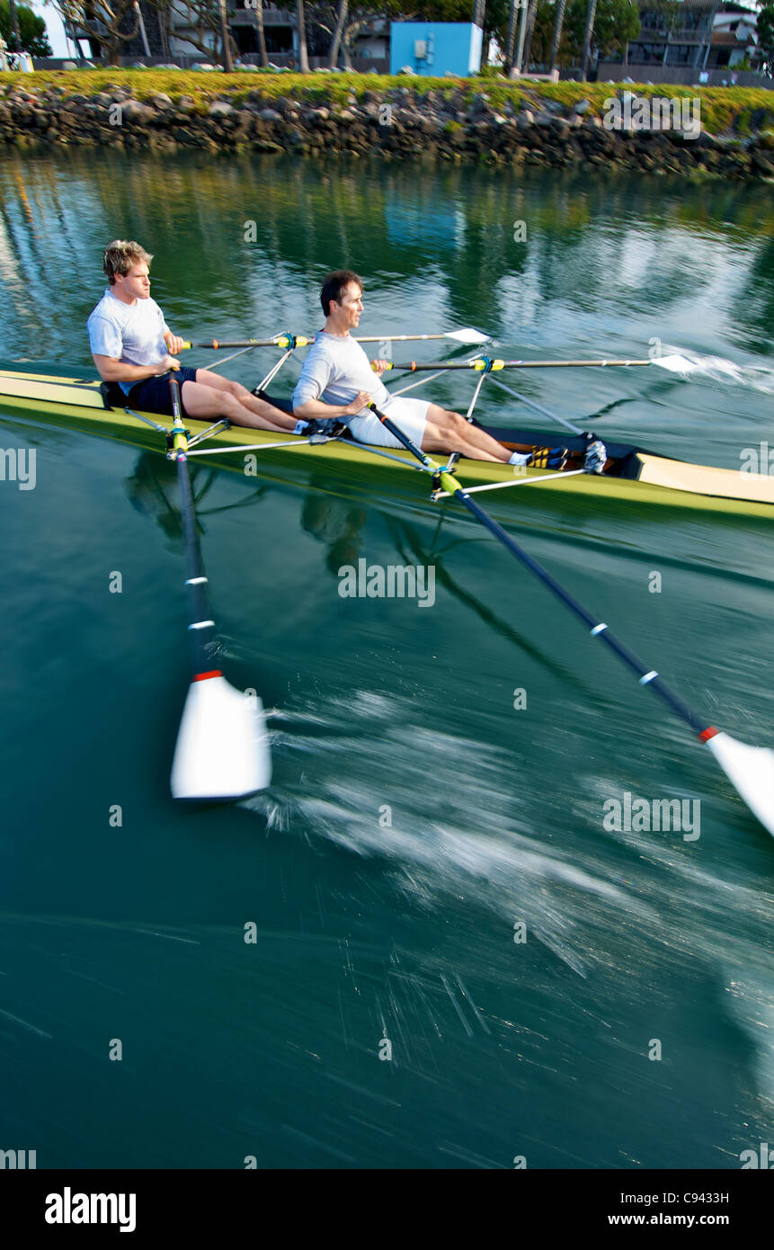 Rowers rowing in a double scull rowboat Stock Photo - Alamy