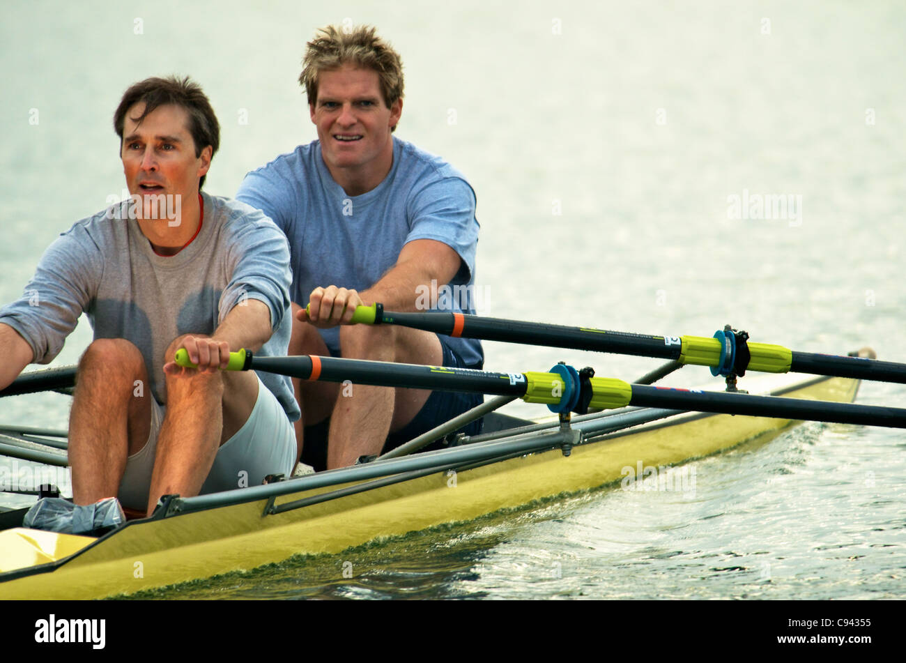 Rowers rowing in a double scull rowboat Stock Photo - Alamy