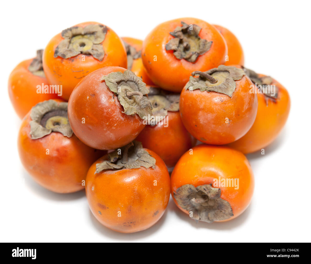 Red juicy persimmons isolated on white background Stock Photo - Alamy