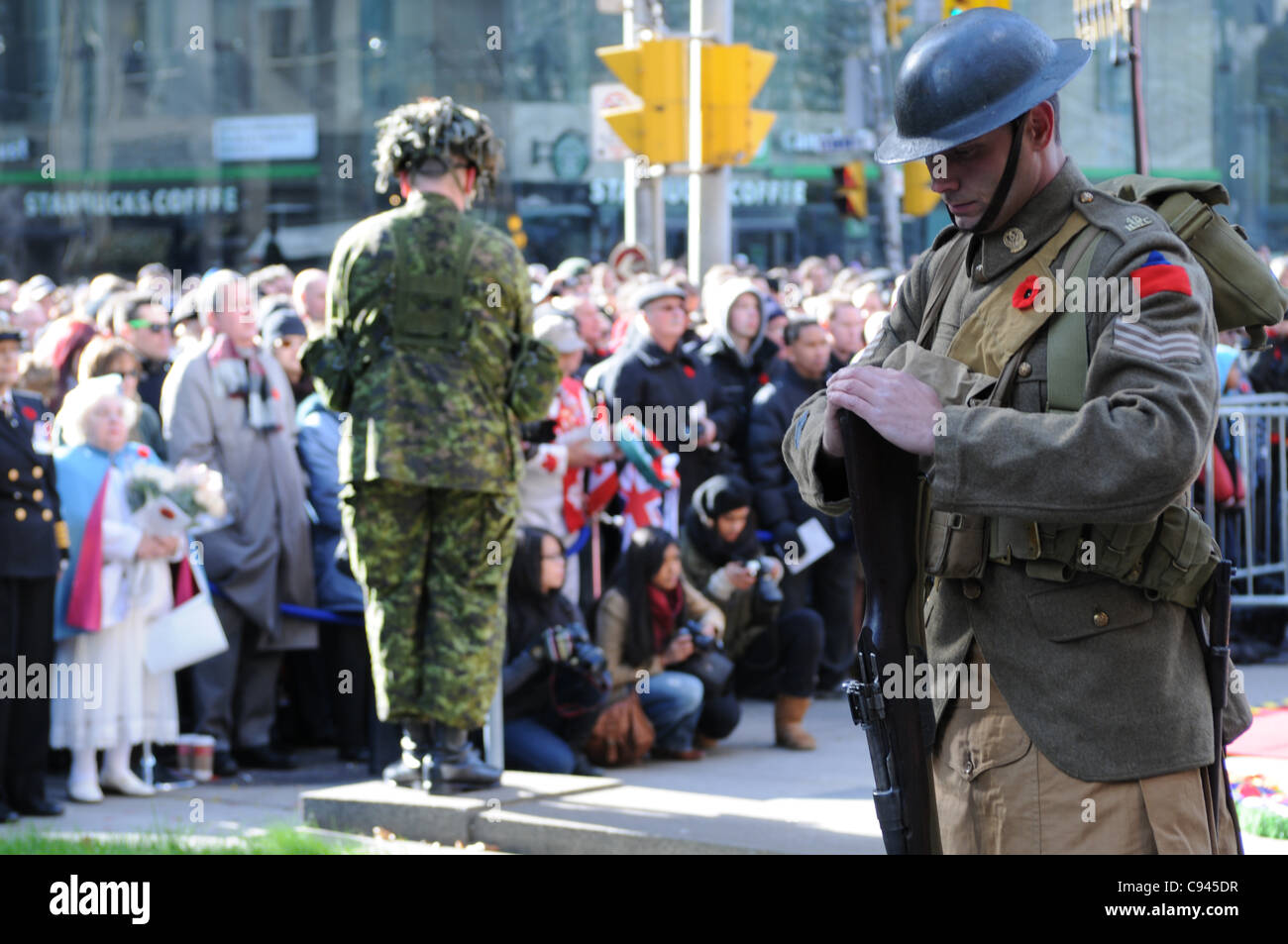 Two silent sentries on solemn guard amidst Torontonians during the ...