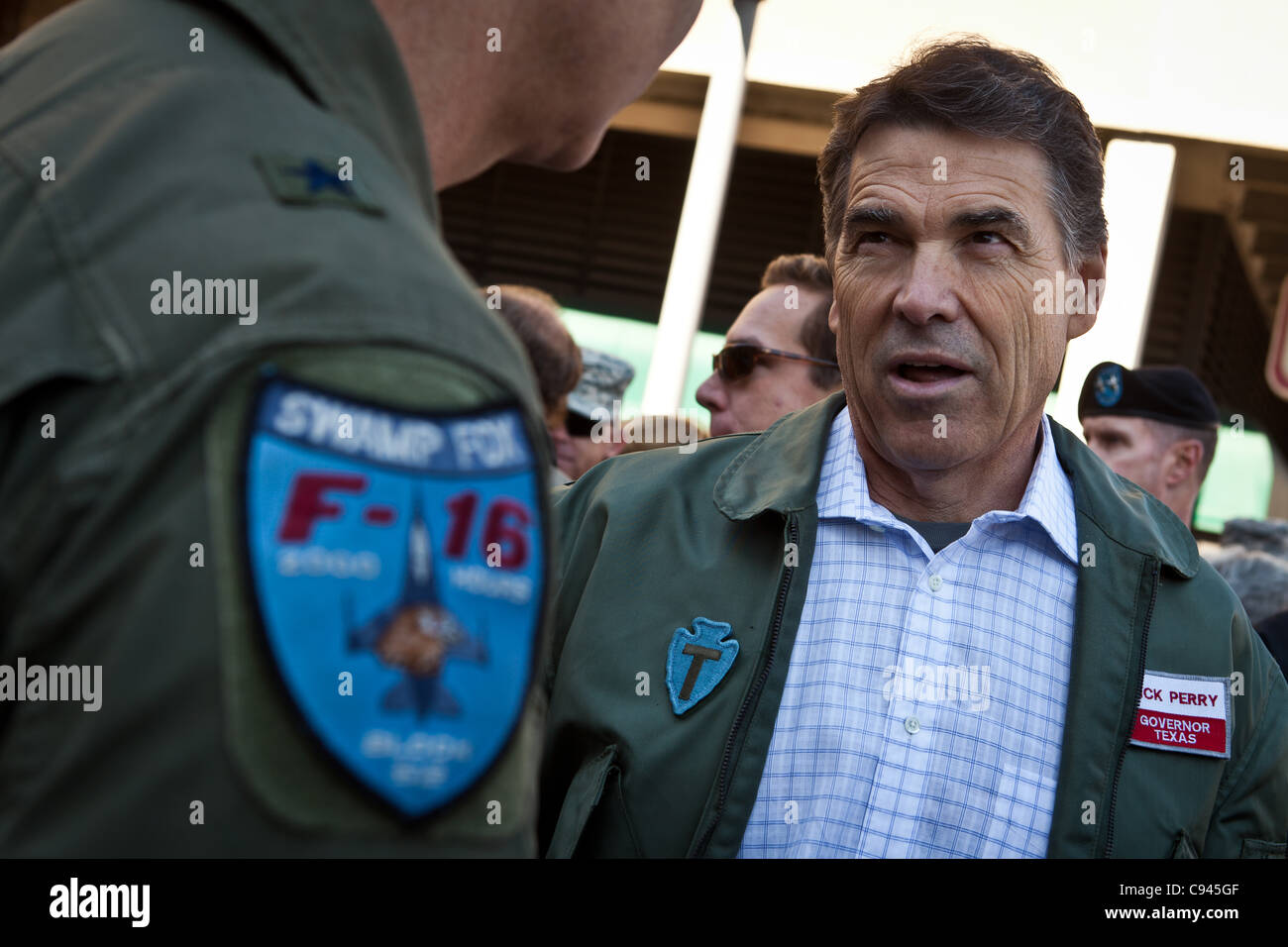Republican presidential candidate Gov. Rick Perry talks to an Air Force ...