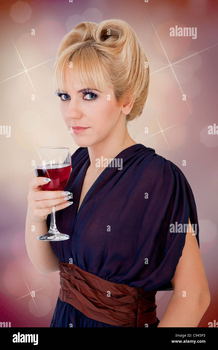 Beautiful woman with an alcoholic drink Stock Photo - Alamy