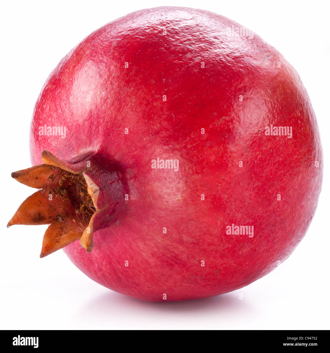 Ripe pomegranate isolated on a white background Stock Photo - Alamy