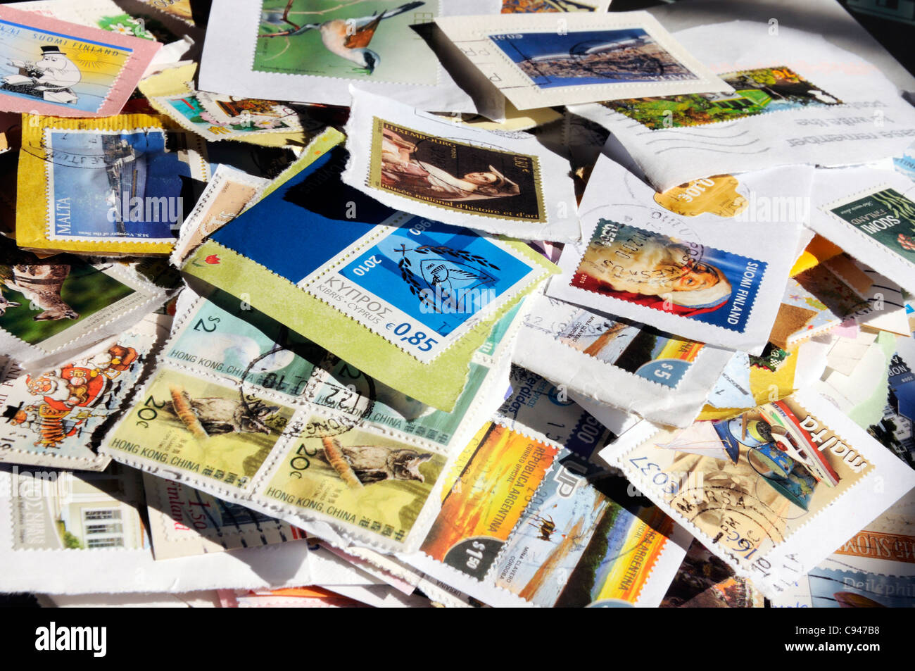 Assortment used postage stamp collecting hi-res stock photography and ...