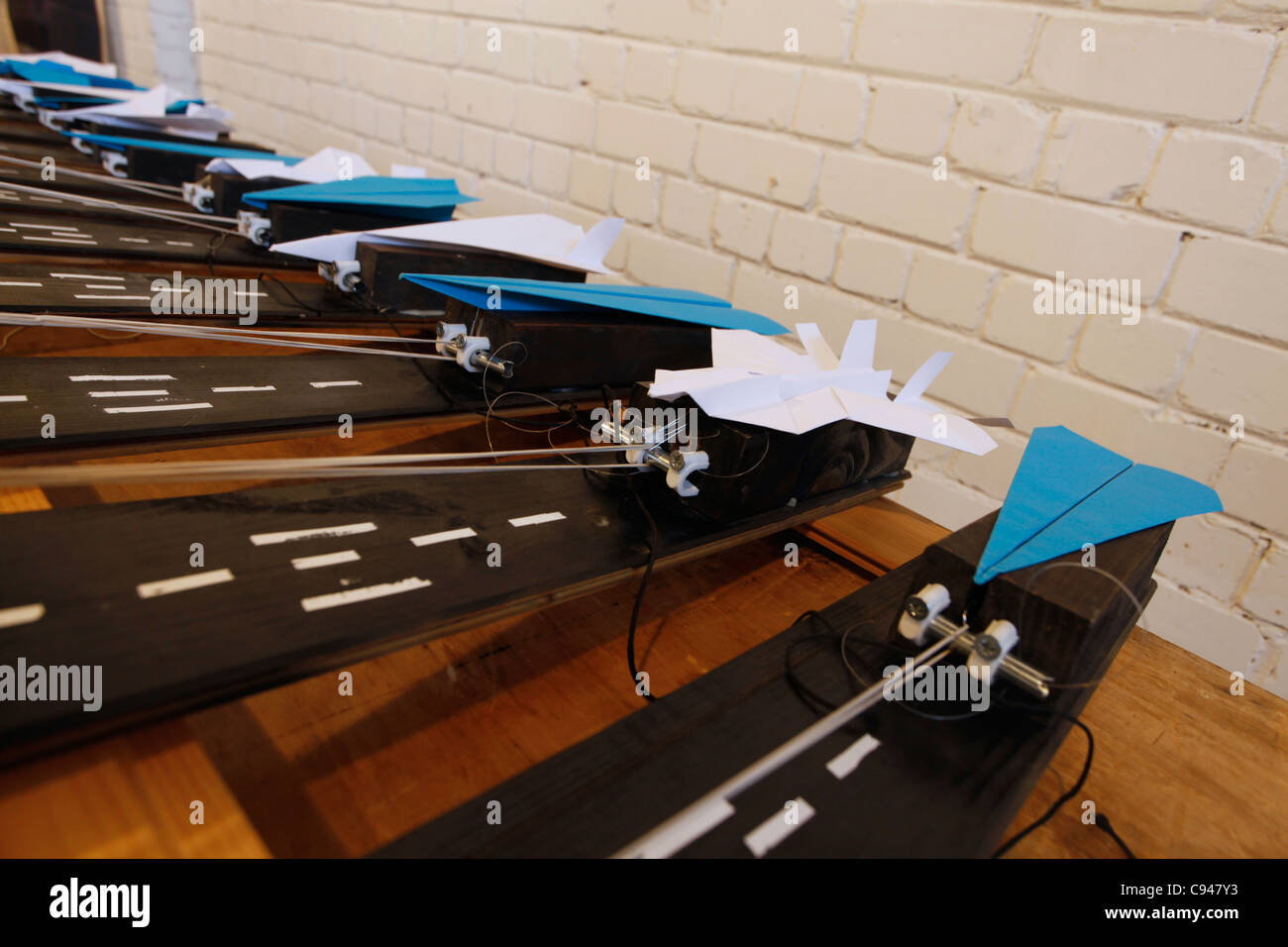 Paper airplanes on Multi Track Rubber Band launcher displayed at an ...