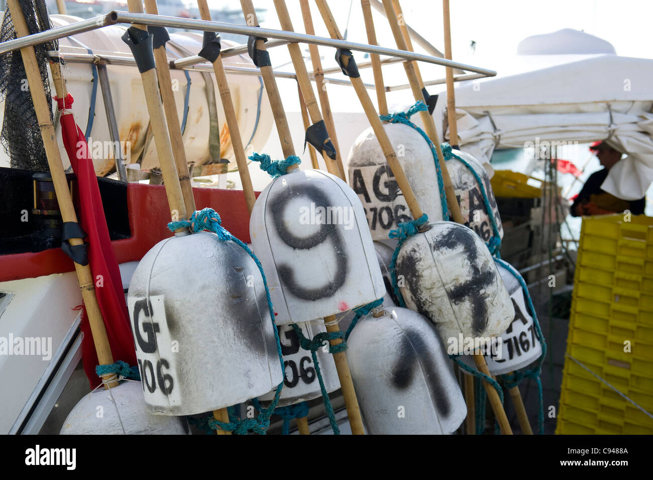 Fishing poles on trawler moored in the Bassin du Manche, fishing port ...