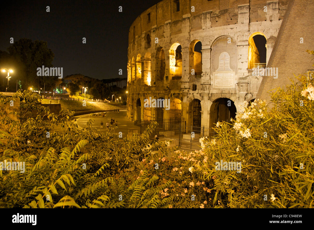 Coliseum illuminated at night showcasing the grandeur of ancient Rome ...
