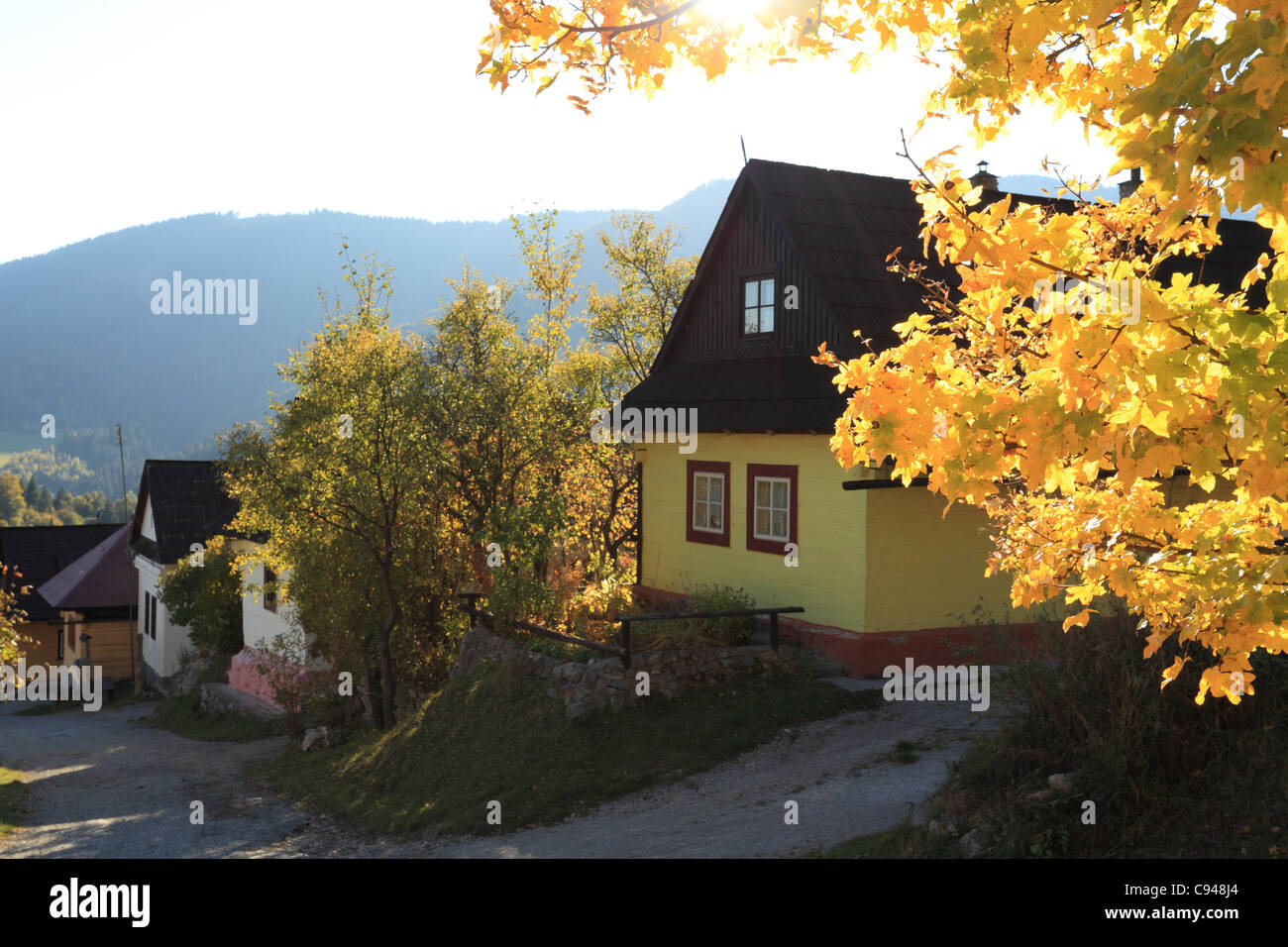 Traditional painted wooden cottages in Vlkolinec, Slovakia. Village is ...