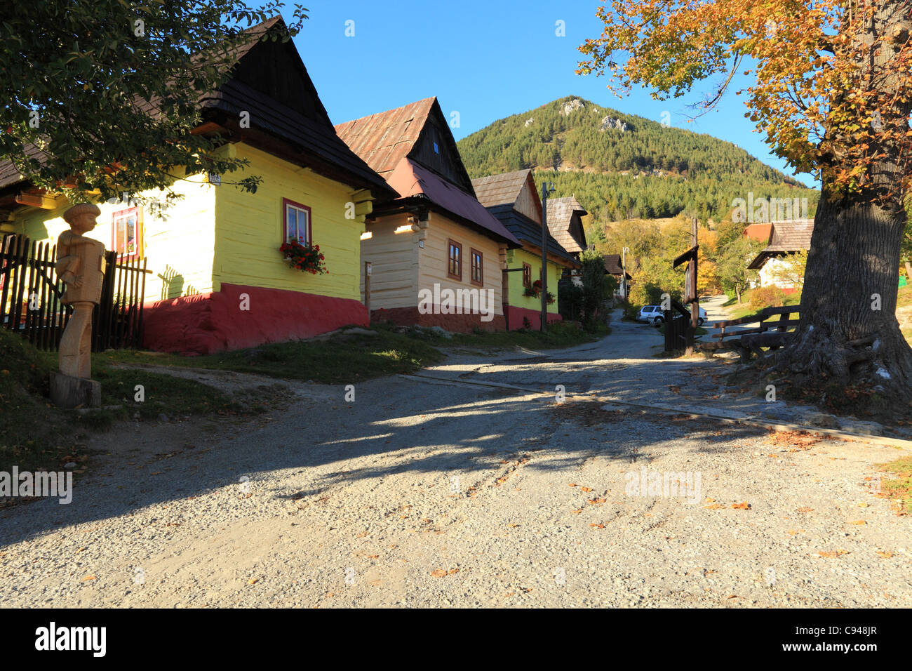 Traditional painted wooden cottages in Vlkolinec, Slovakia. Village is ...
