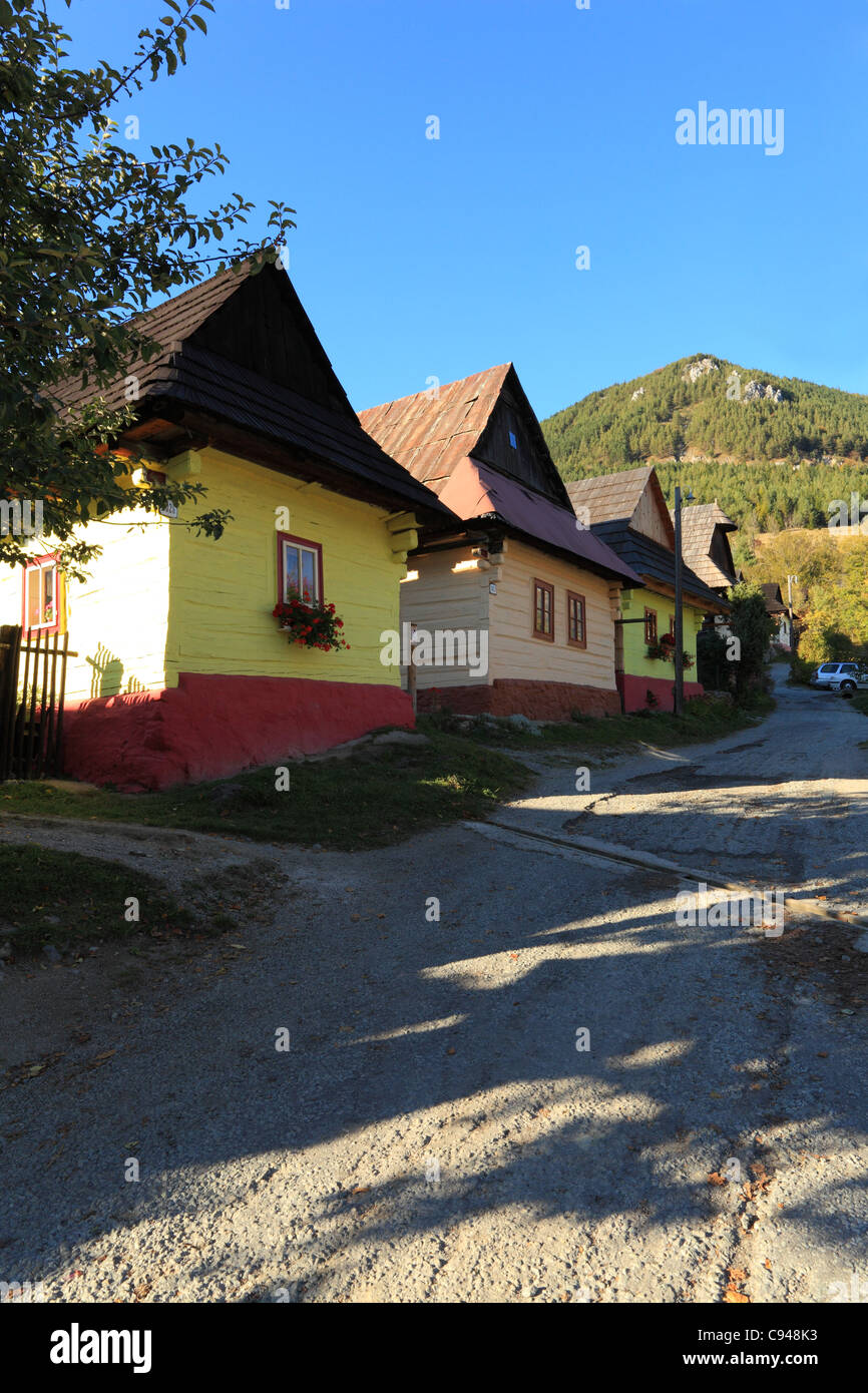 Traditional painted wooden cottages in Vlkolinec, Slovakia. Village is ...