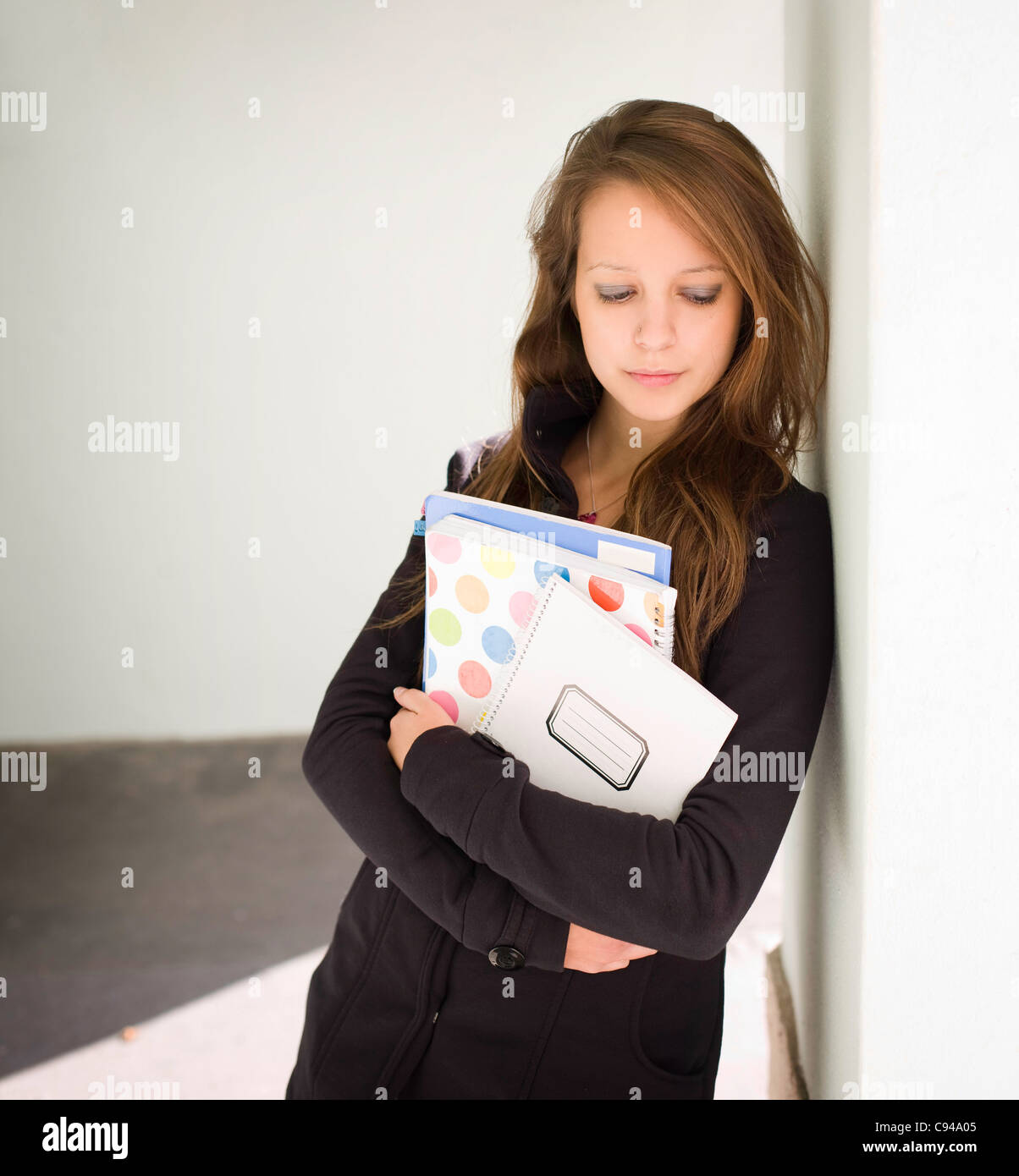 Portrait of tired looking young student girl Stock Photo - Alamy