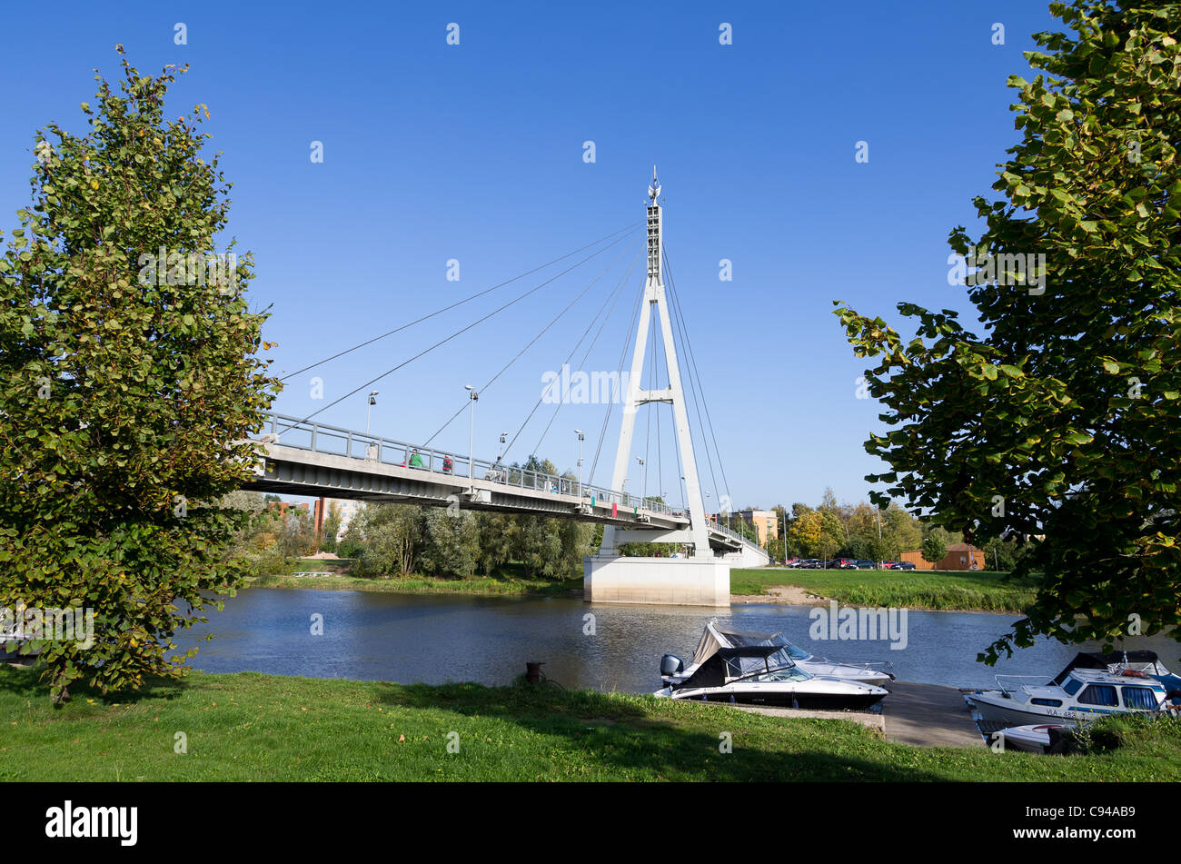 Cable-stayed bridge in the city Tartu, Estonia over the river "Emajõgi ...