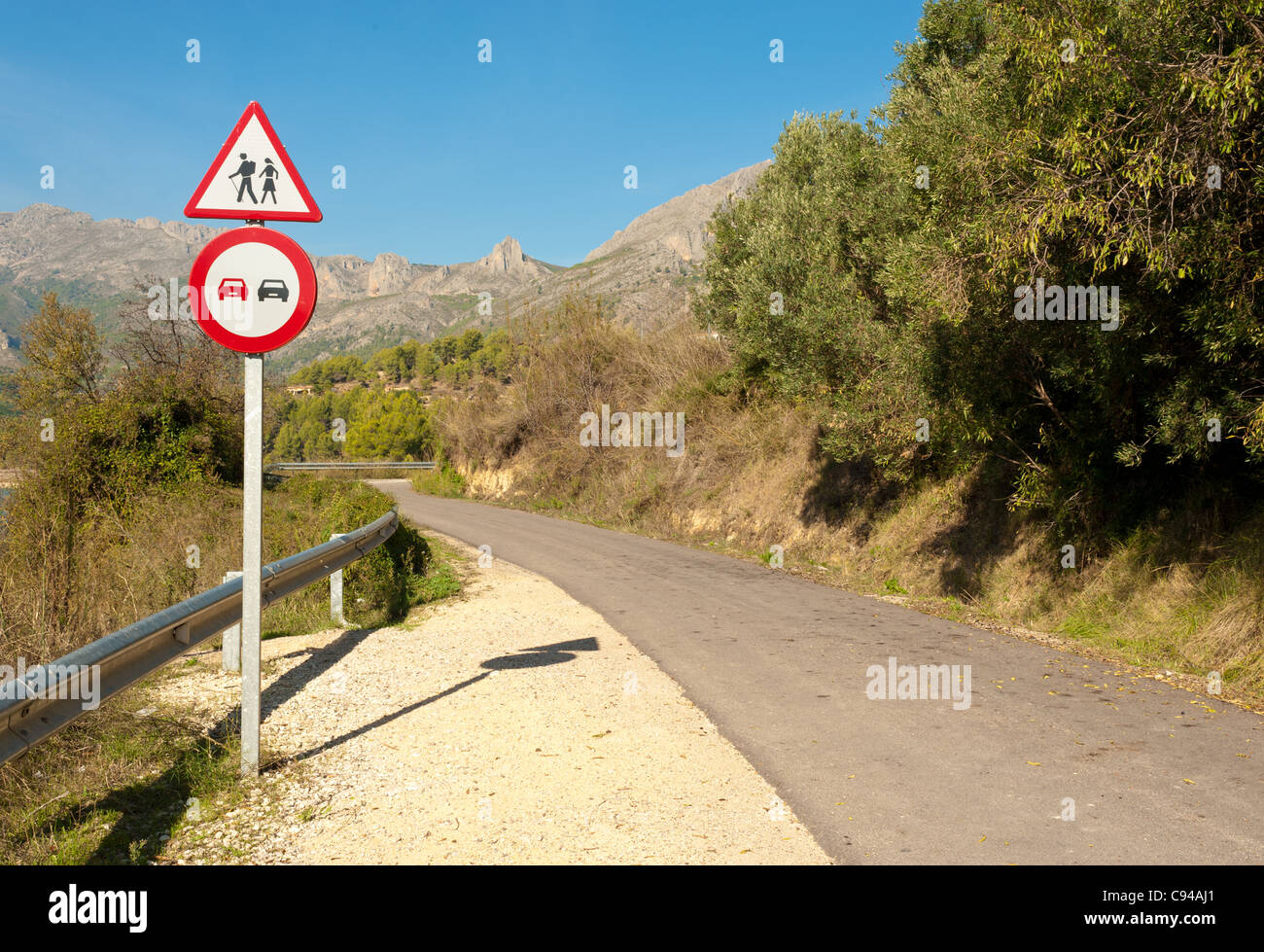 Signpost on a rural road warning drivers of hikers Stock Photo - Alamy