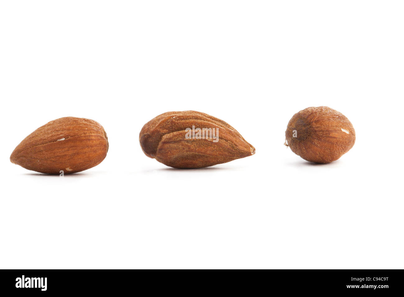 Three Almond Nuts Isolated on White Background Stock Photo - Alamy