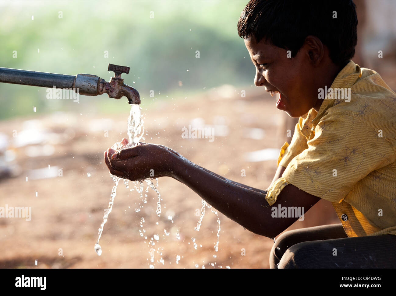 Ethnic Child Drinking Water From Tap High Resolution Stock Photography ...