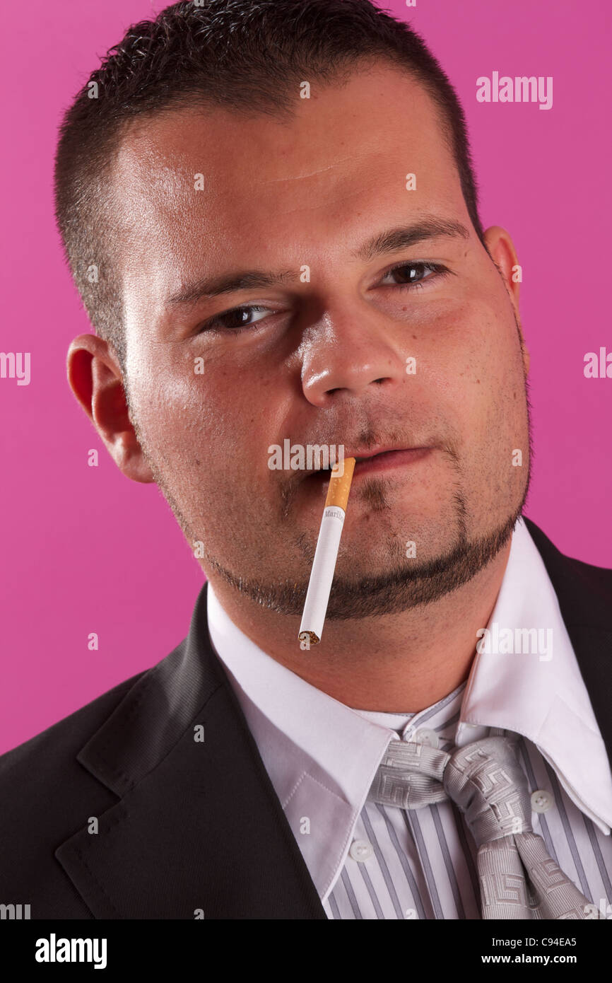 business man smoking cigarette Stock Photo - Alamy