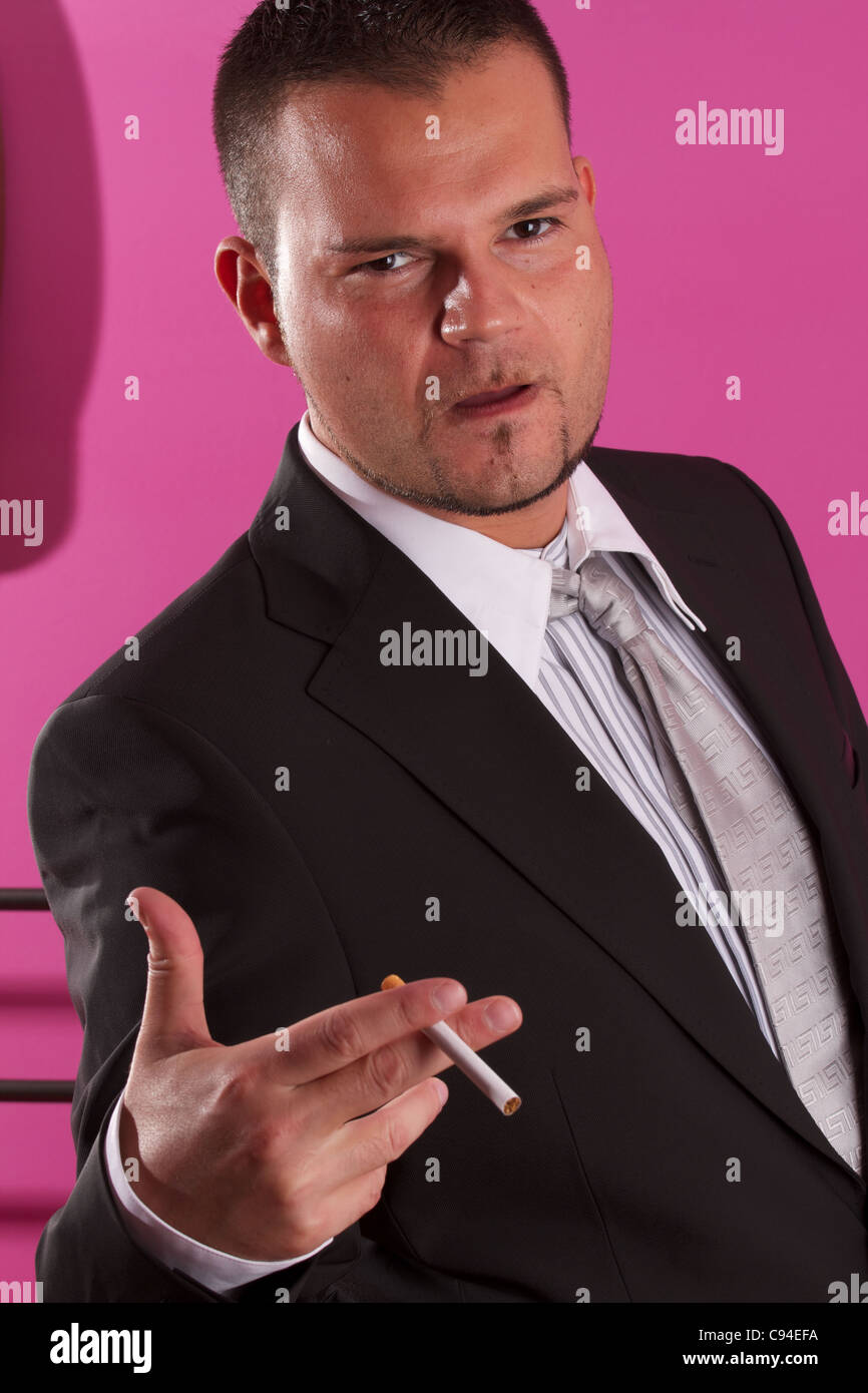 business man smoking cigarette Stock Photo - Alamy