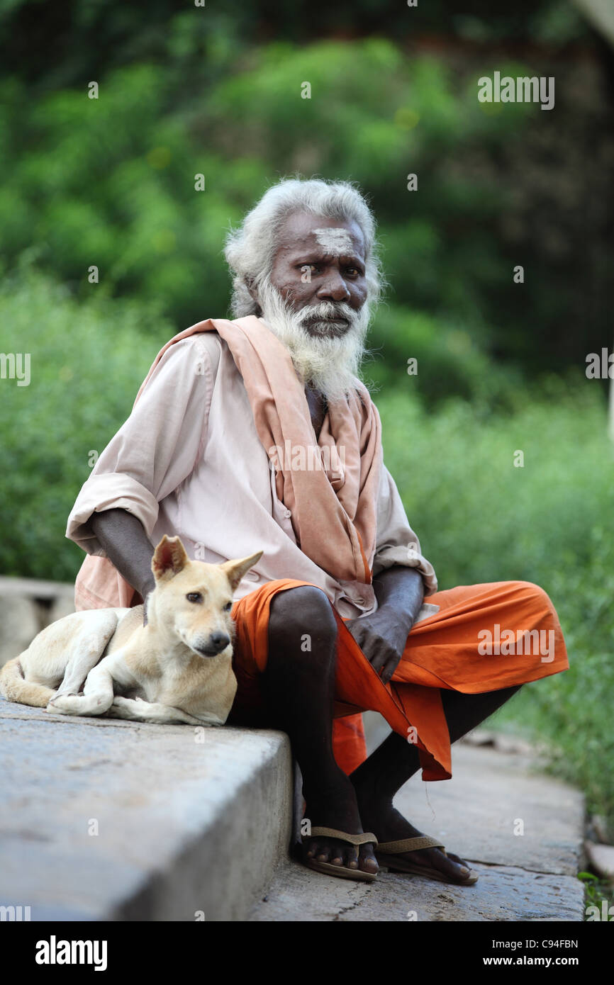 Man sadhu with dog Arunachala South India Stock Photo - Alamy