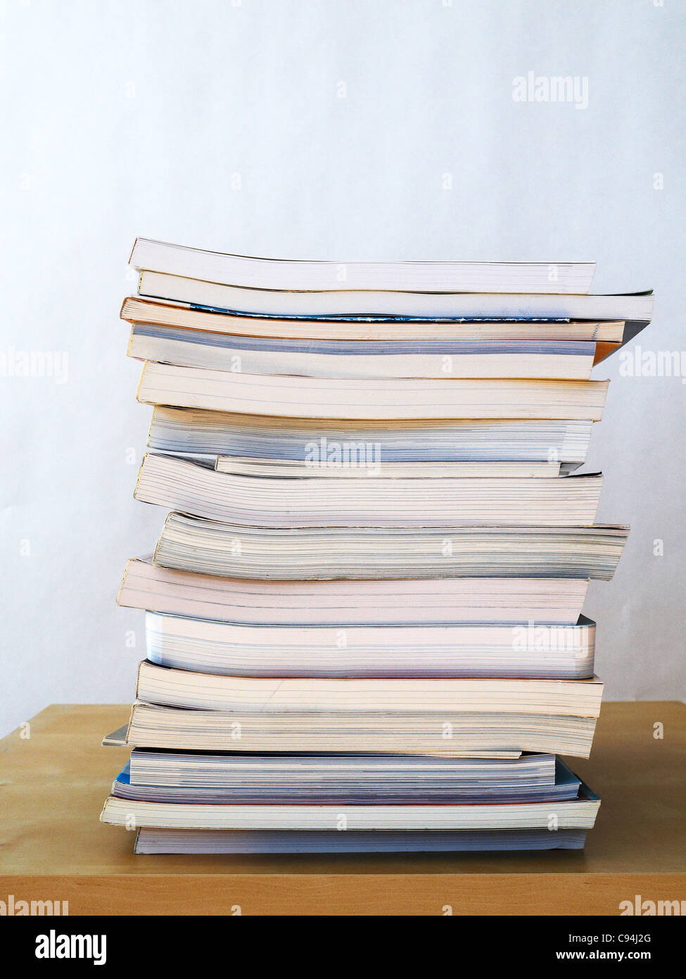 Stack of books on table Stock Photo - Alamy