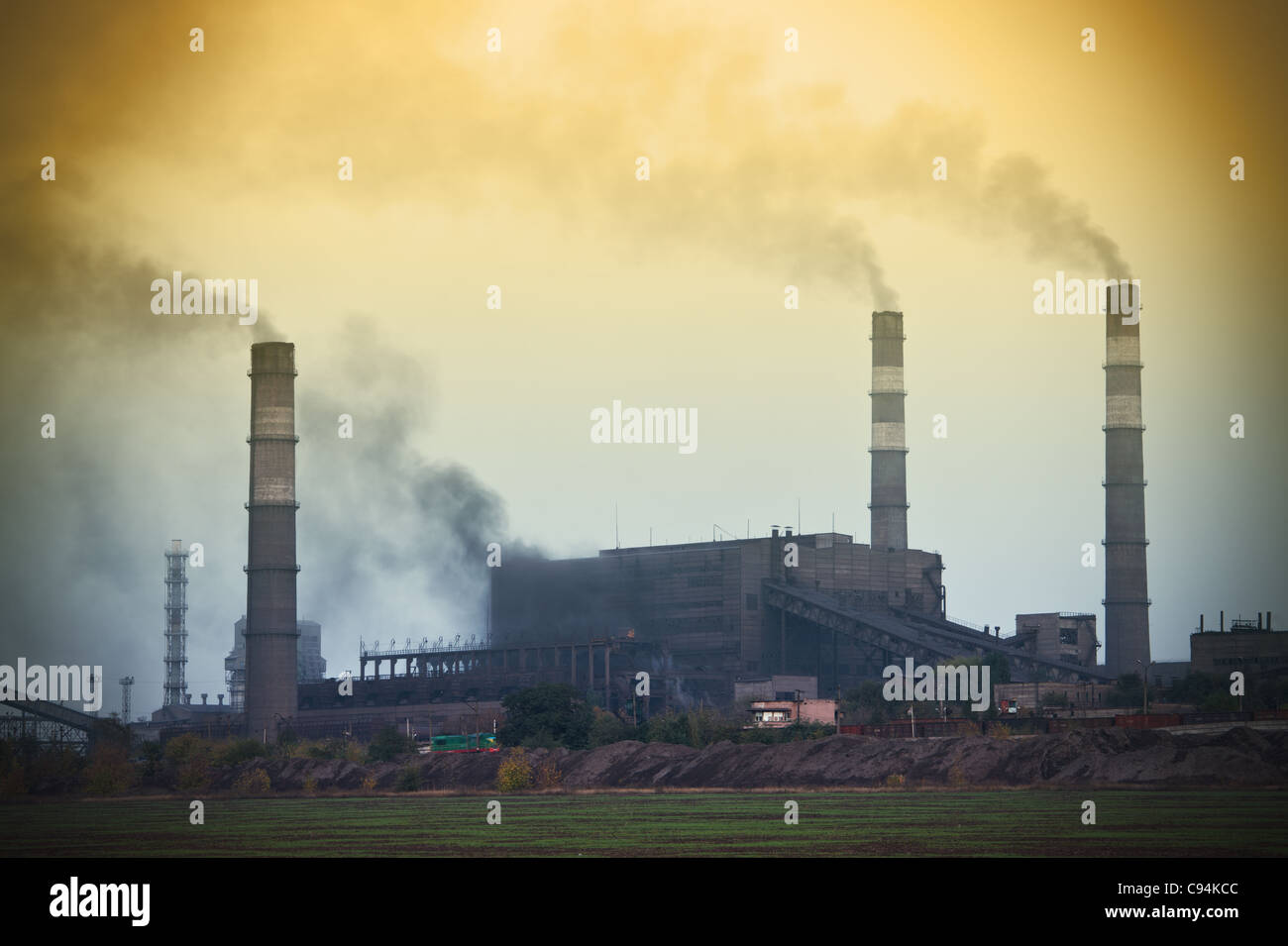 Power plant with yellow smoke Stock Photo - Alamy