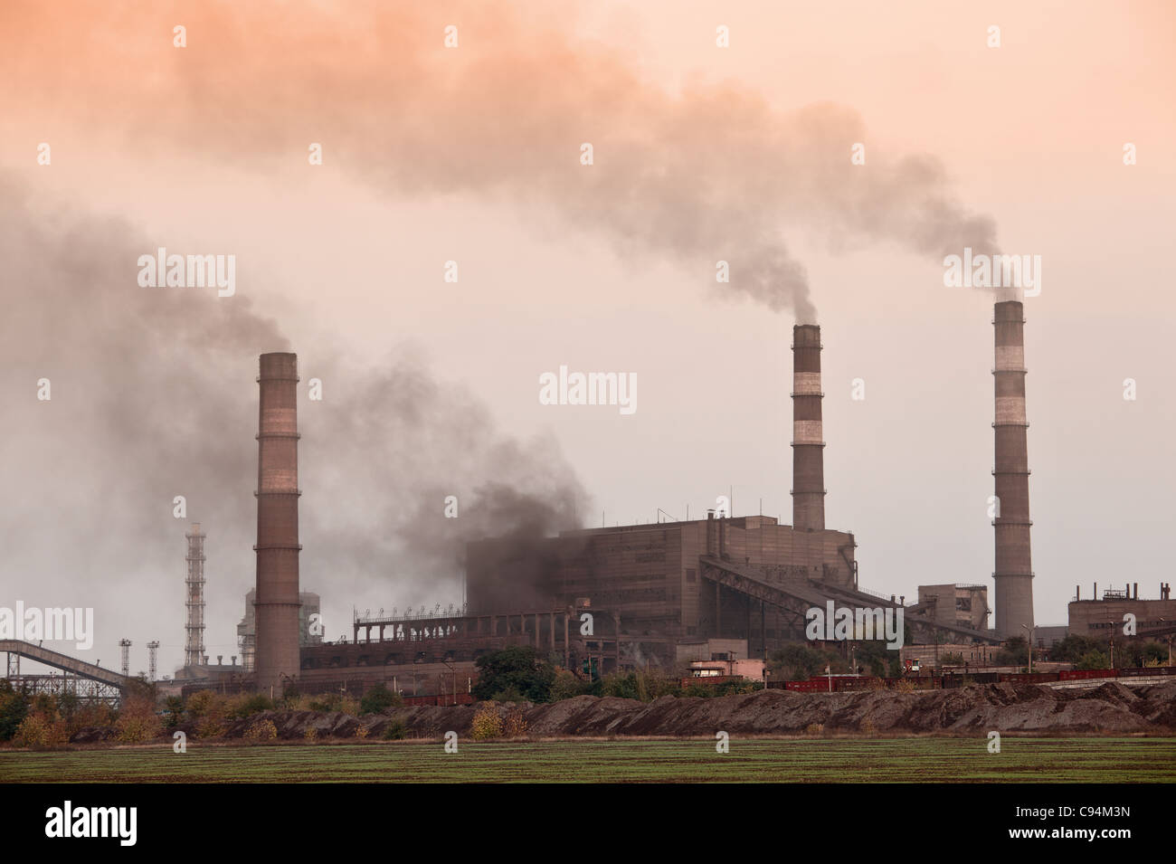 Power plant with yellow smoke Stock Photo - Alamy