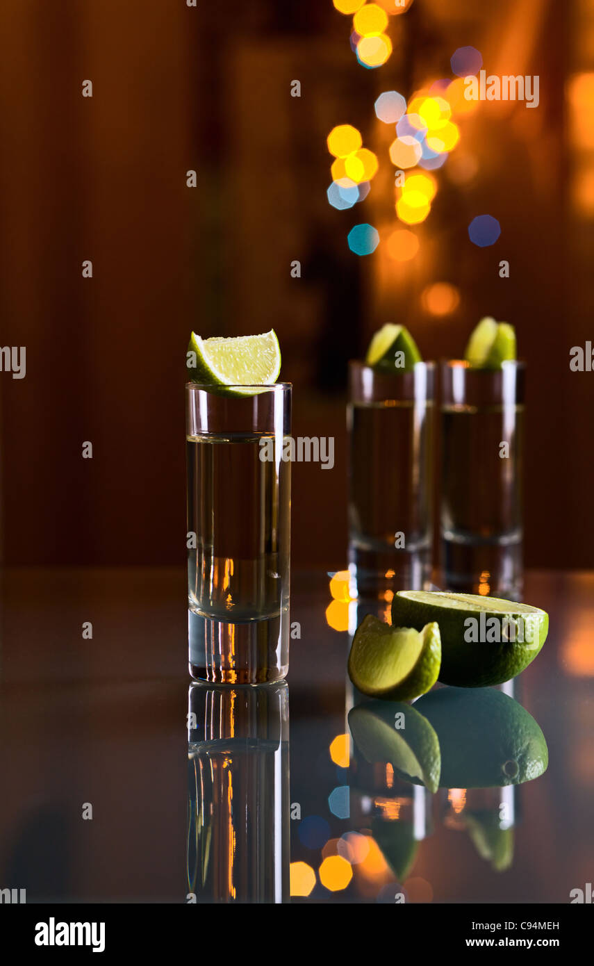 tequila and lime on a glass table Stock Photo - Alamy