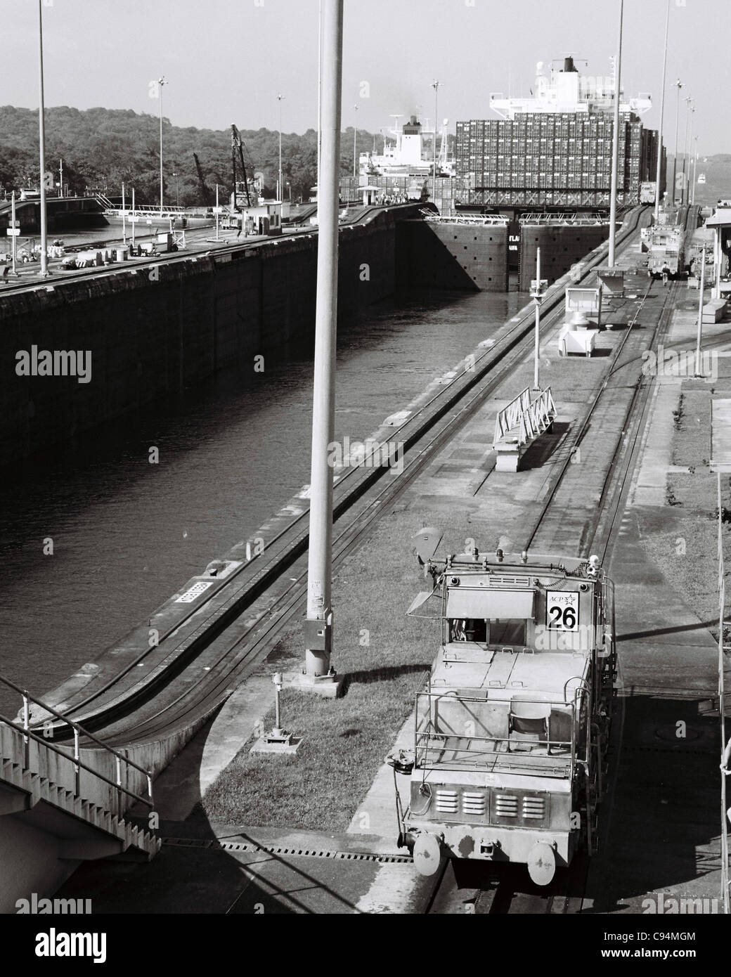 Ship being guided through the Gatun Lock chambers on the Caribbean side ...