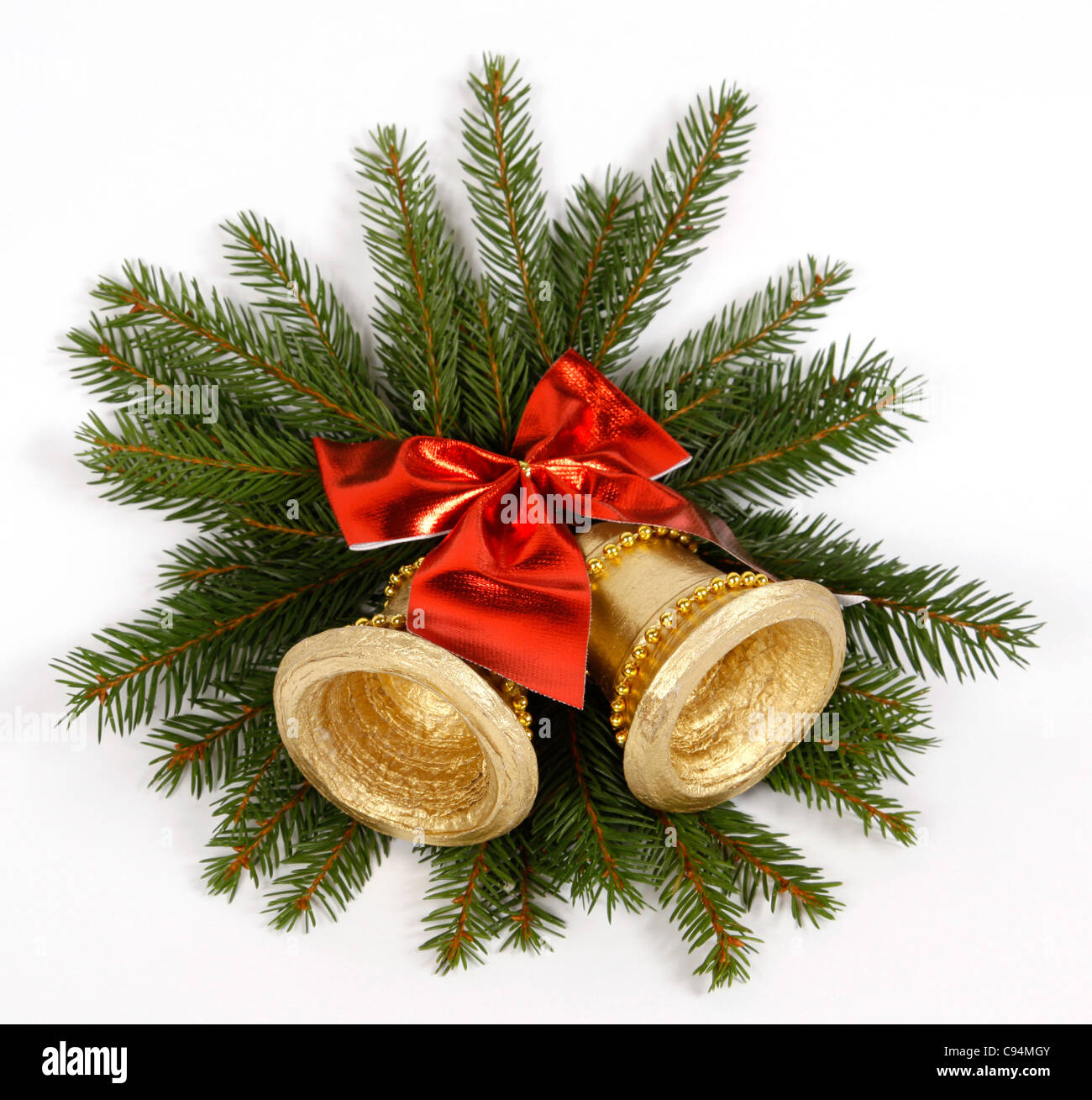Two golden bells with the red big bow Stock Photo - Alamy
