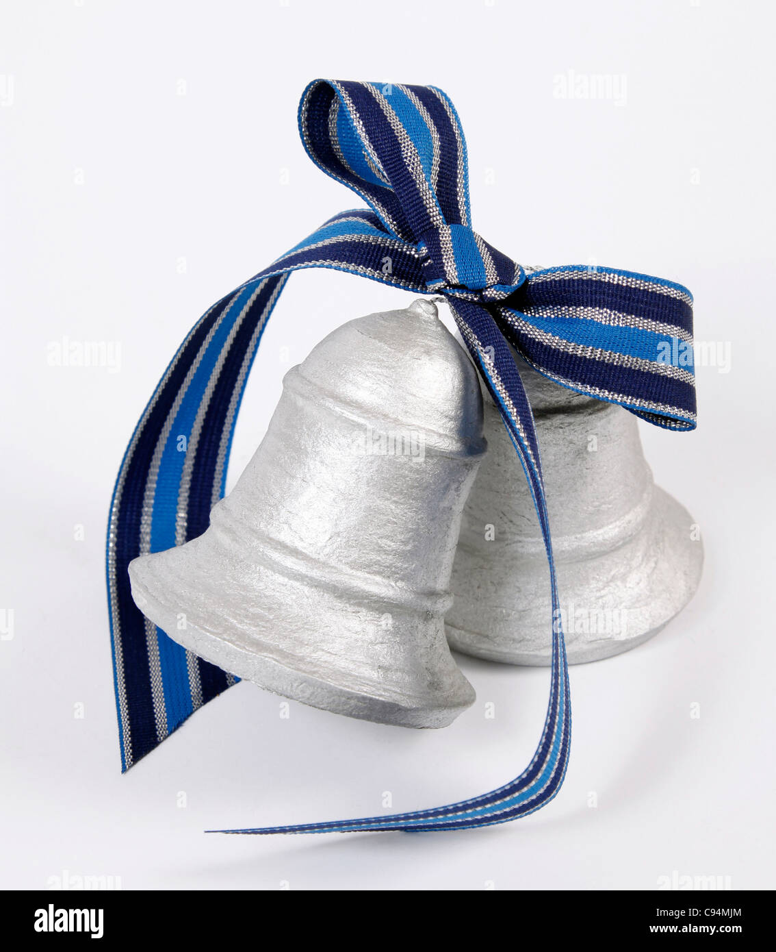 Two silvery bells on the white background Stock Photo - Alamy