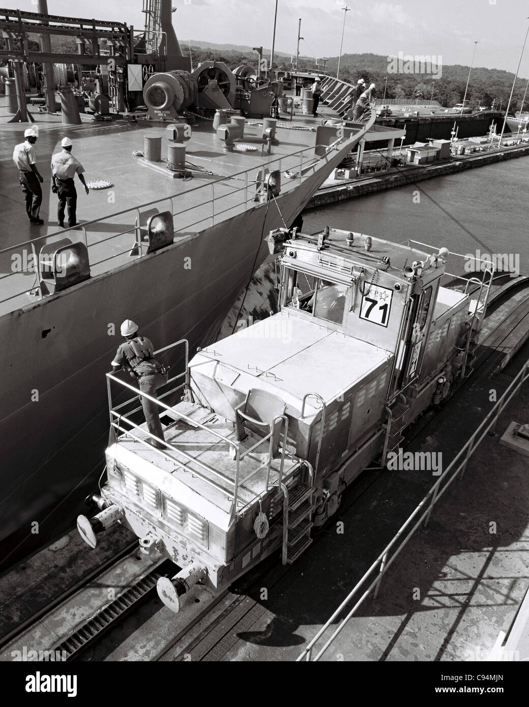 Ship being guided through the Gatun Lock chambers on the Caribbean side ...