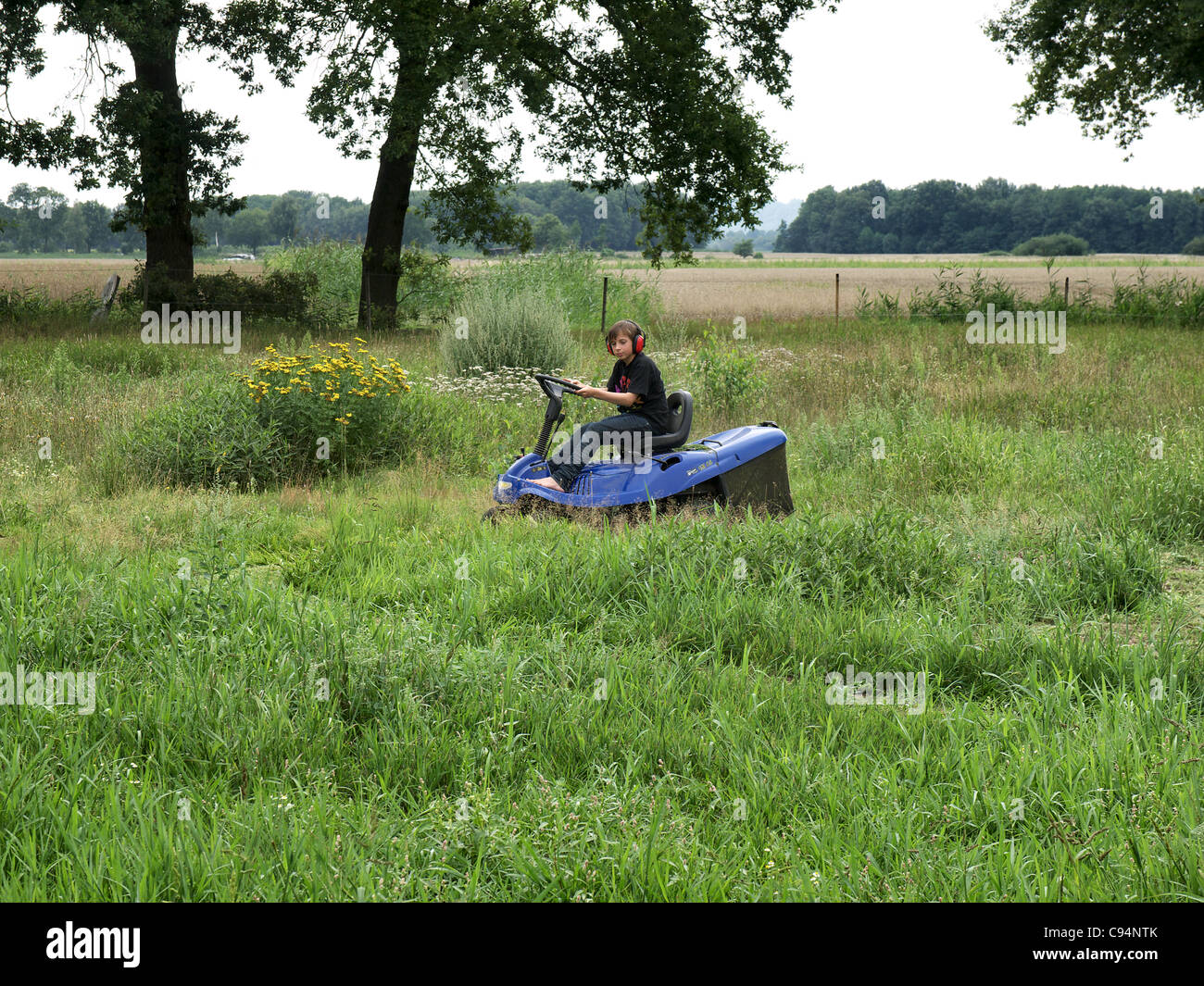 Rough grass mowers hi-res stock photography and images - Alamy