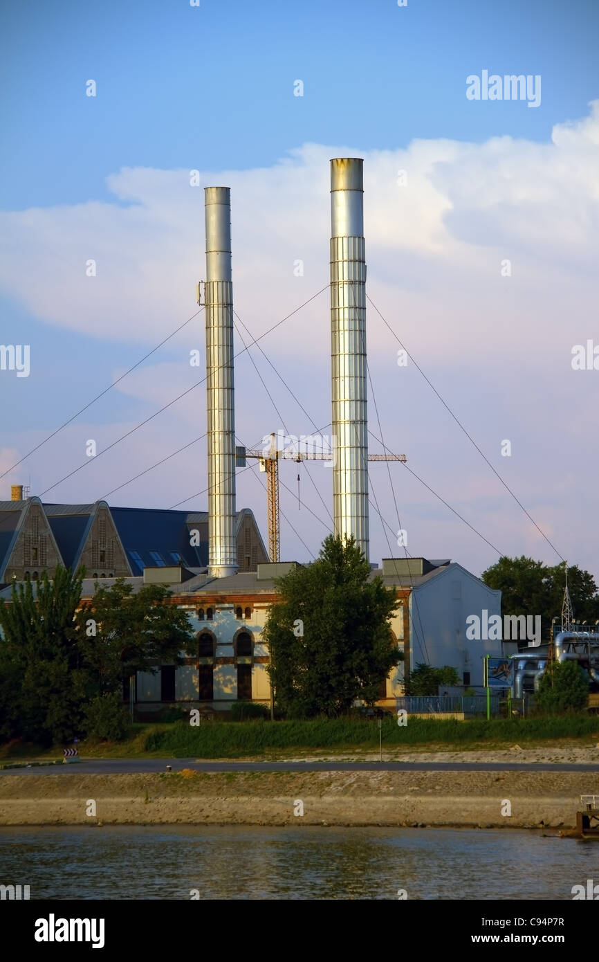 Industrial view in suburban area over lake to factory towers Stock ...