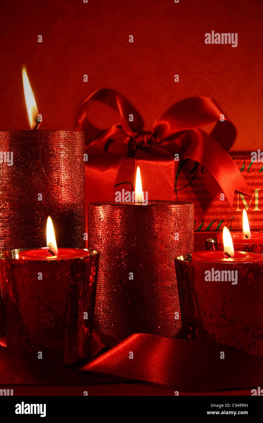 Red Christmas candles on vintage background Stock Photo - Alamy