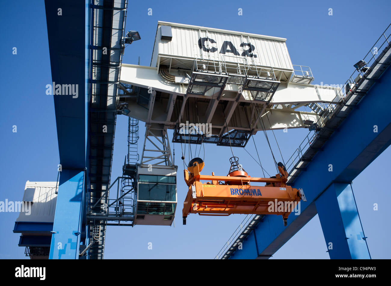 Huge cranes handle cargo and containers at the Haifa Port as it ...