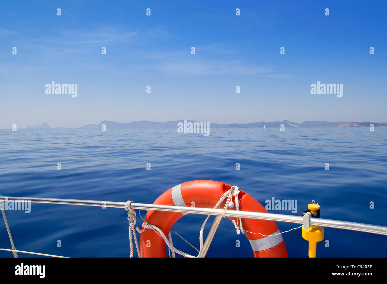 boat in Ibiza with round red lifesaver buoy and yellow beacon Stock ...