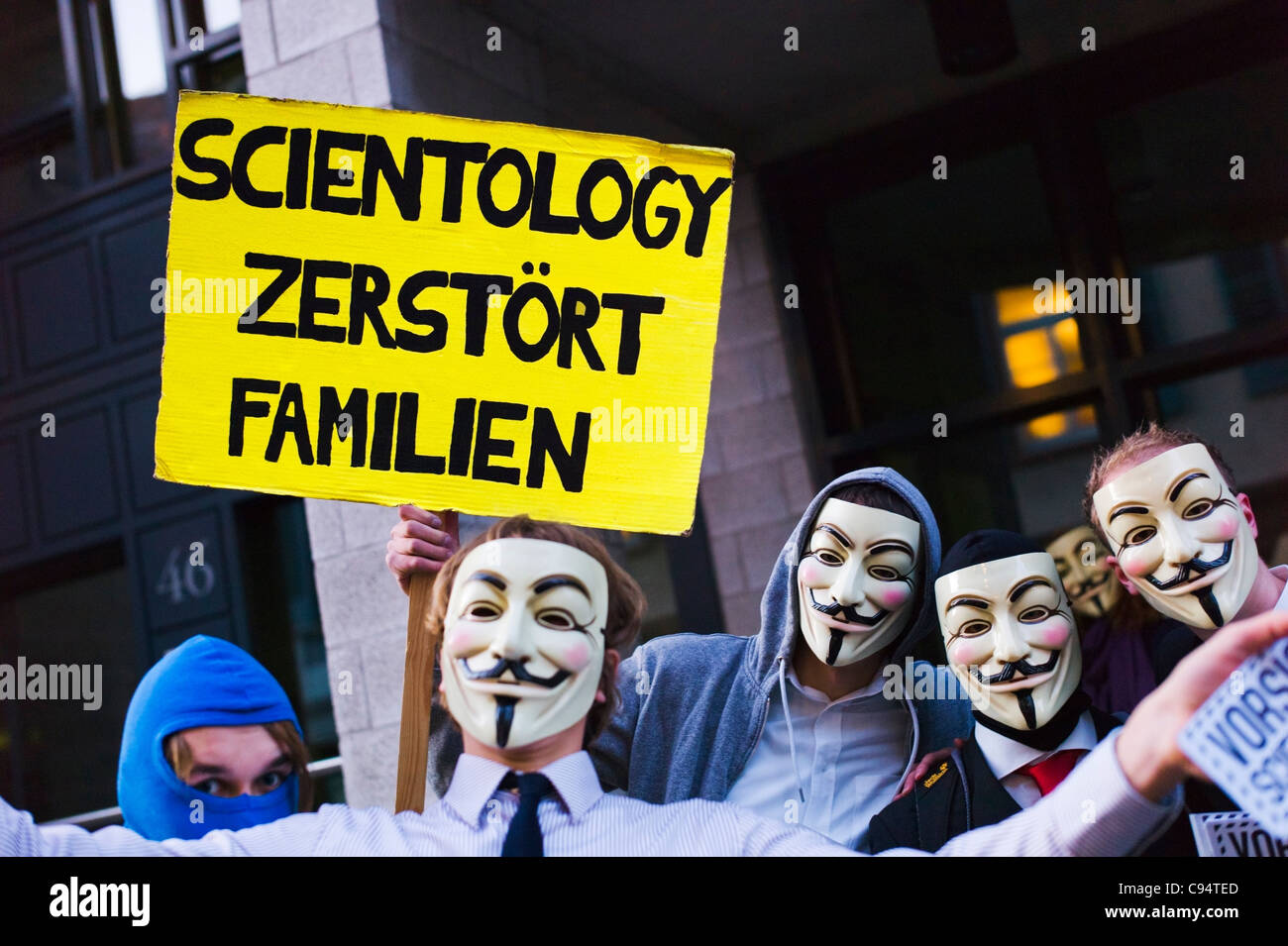 Masked protesters protest outside a Scientology building Karlsruhe ...