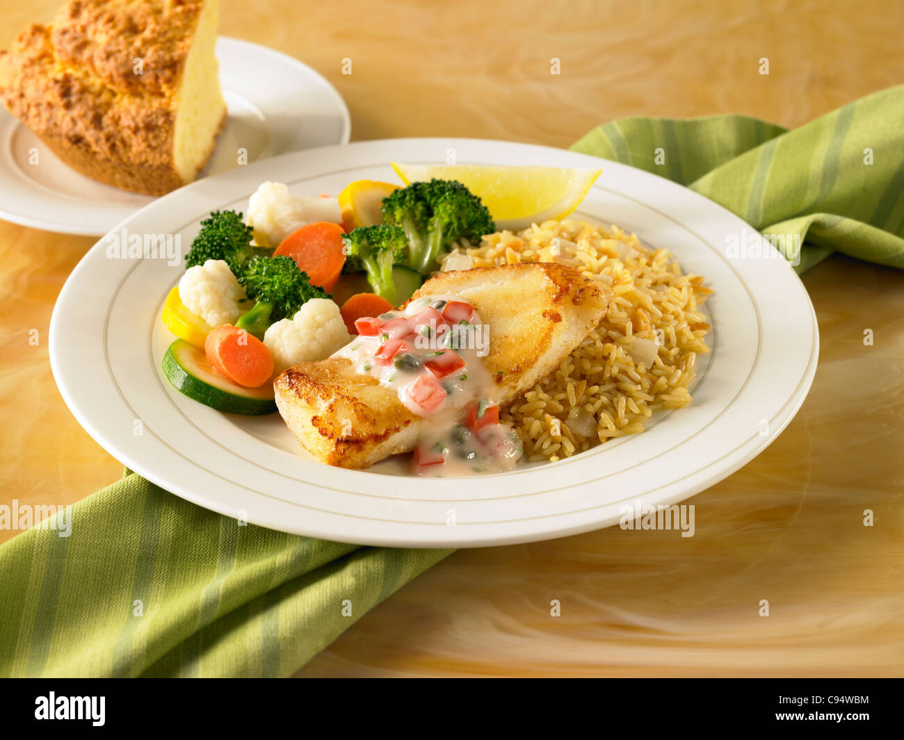 Cod dinner with vegetables and rice Stock Photo - Alamy