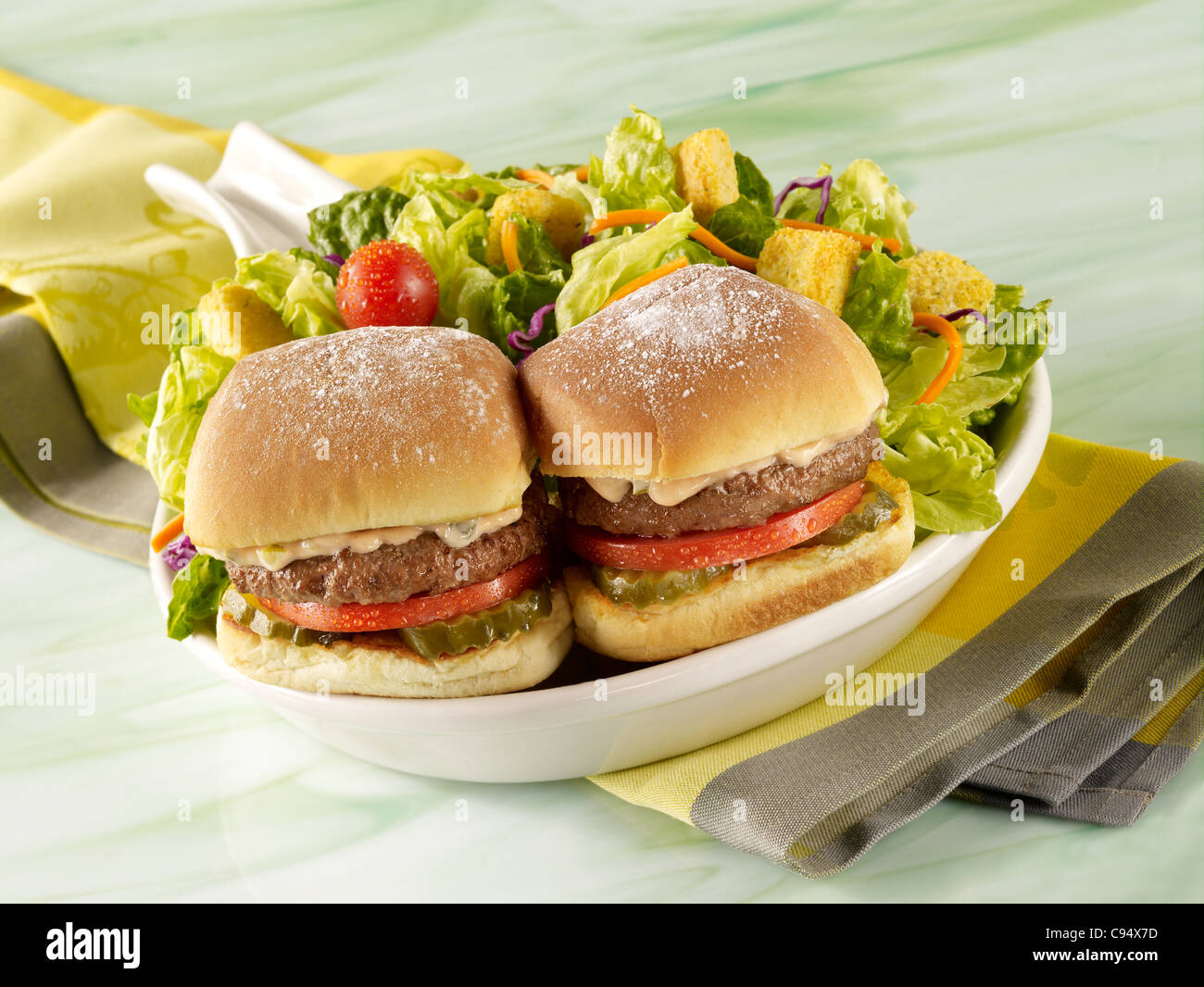 Two mini burgers served with a side salad Stock Photo - Alamy