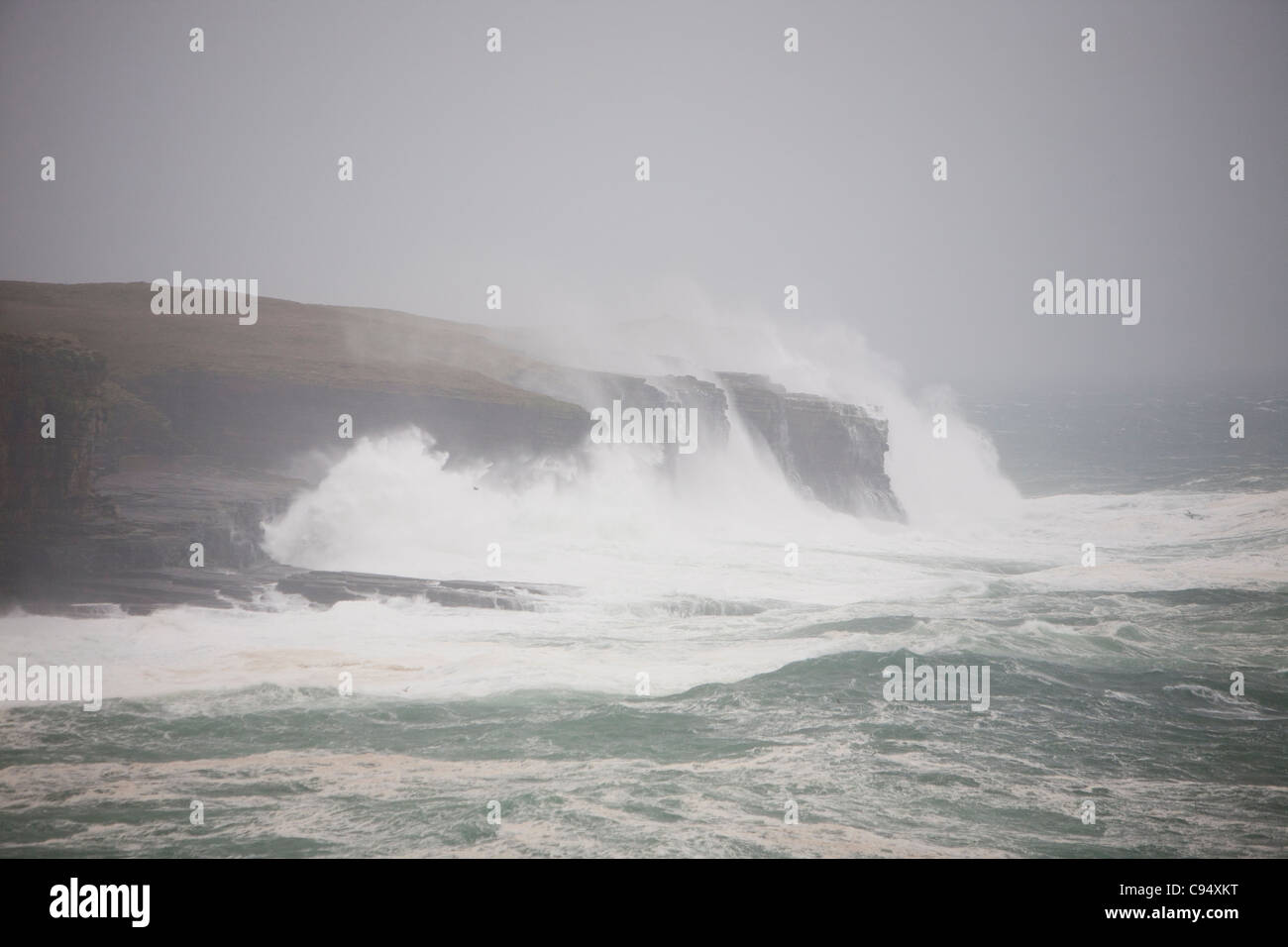 Storm driven waves crashing over 80 foot cliffs at Deerness on Orkney ...