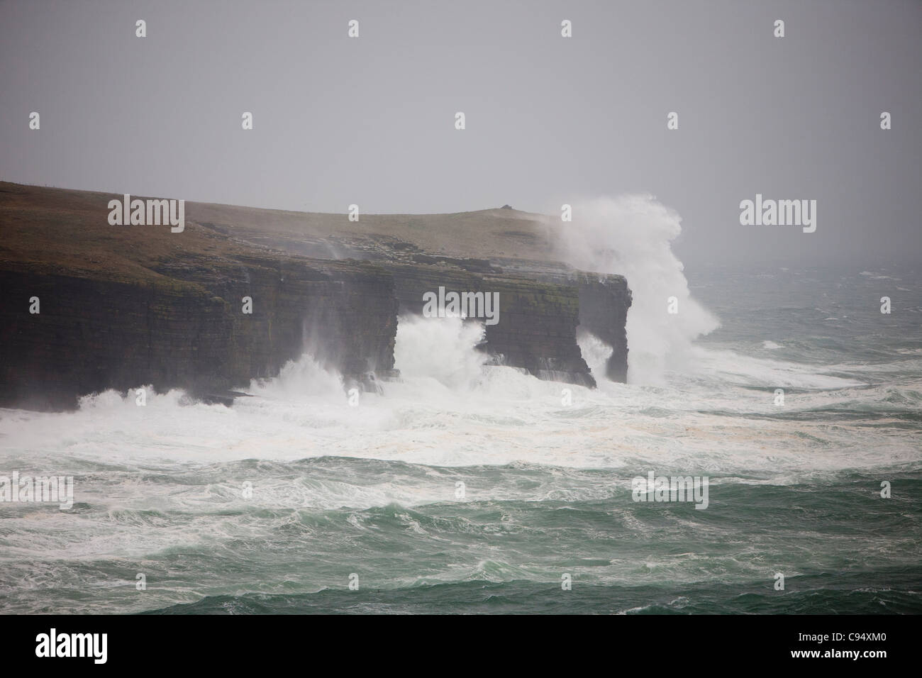 Storm driven waves crashing over 80 foot cliffs at Deerness on Orkney ...