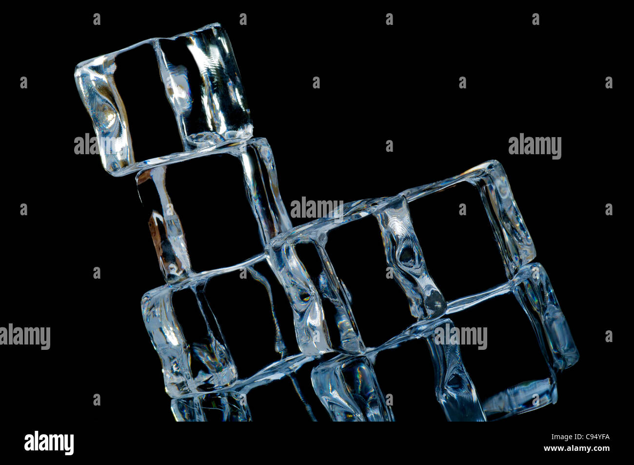 5 ice cube on the black background with reflection Stock Photo - Alamy